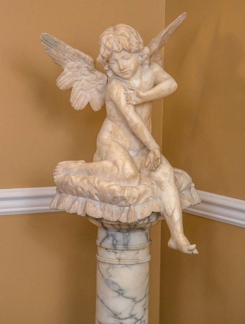 Alabaster Figure Winged Angel Sitting On A Pillow on an Alabaster Pedestal