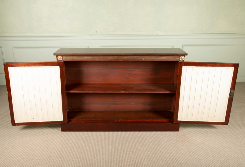An English Regency Mahogany Two Door Credenza on Plinth Base