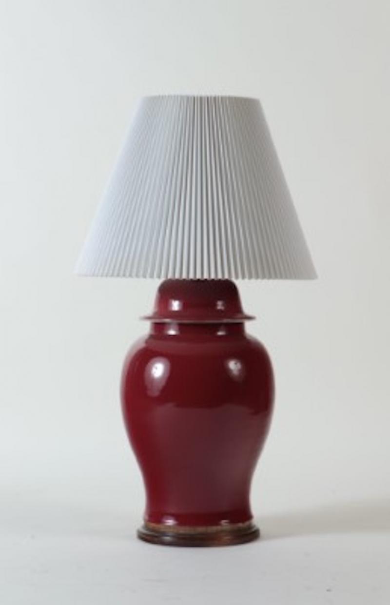 An oxblood vase table lamp on wooden base, circa 1970s