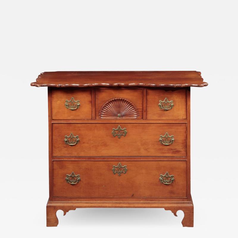 FAN CARVED CHEST OF DRAWERS WITH A SCALLOPED TOP