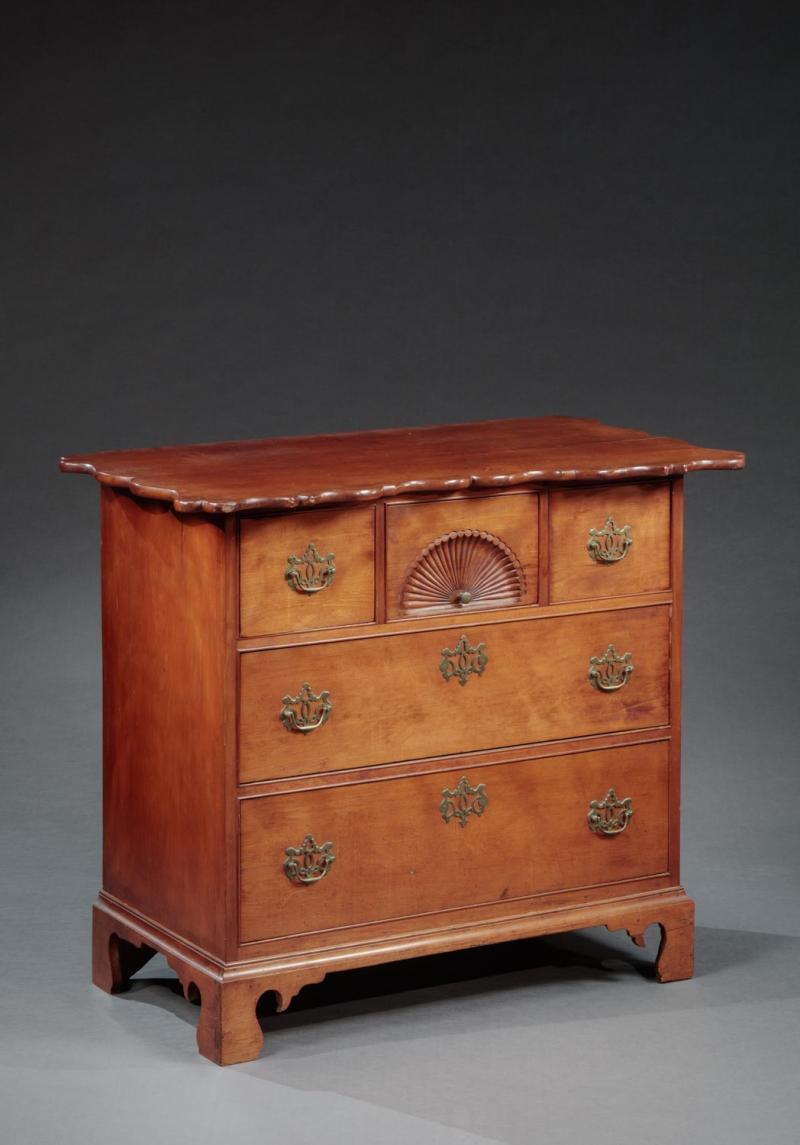 FAN CARVED CHEST OF DRAWERS WITH A SCALLOPED TOP