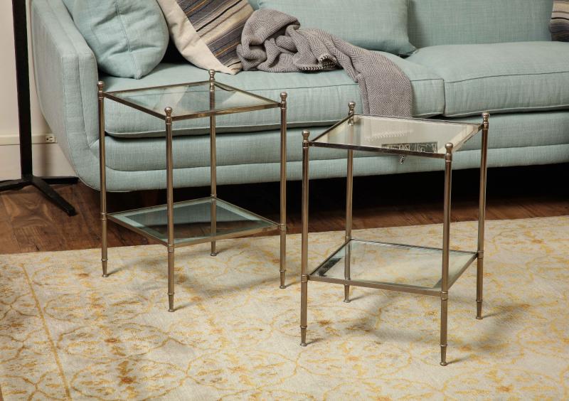 Pair of two-tiered silver gilt side tables