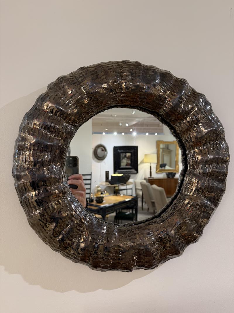Textured raft-shaped mirror, black-chrome metallic glaze. Made By Aram C.