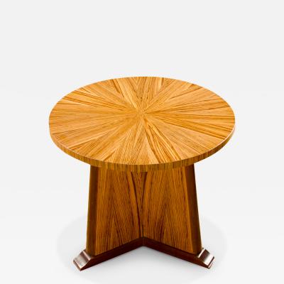 A contemporary round zebra wood table in the Art Deco style.