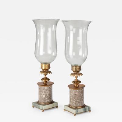 A pair of decorative storm lamps