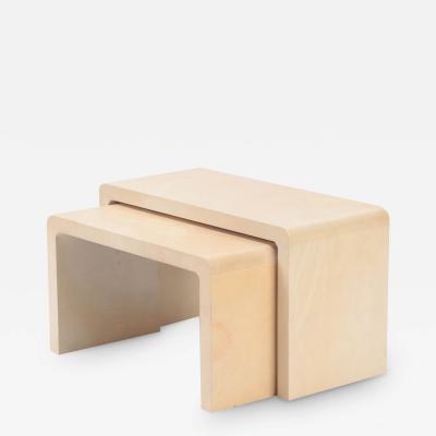 A pair of parchment nesting coffee tables. Contemporary.