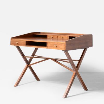 Center desk in walnut with beautiful cross on the base