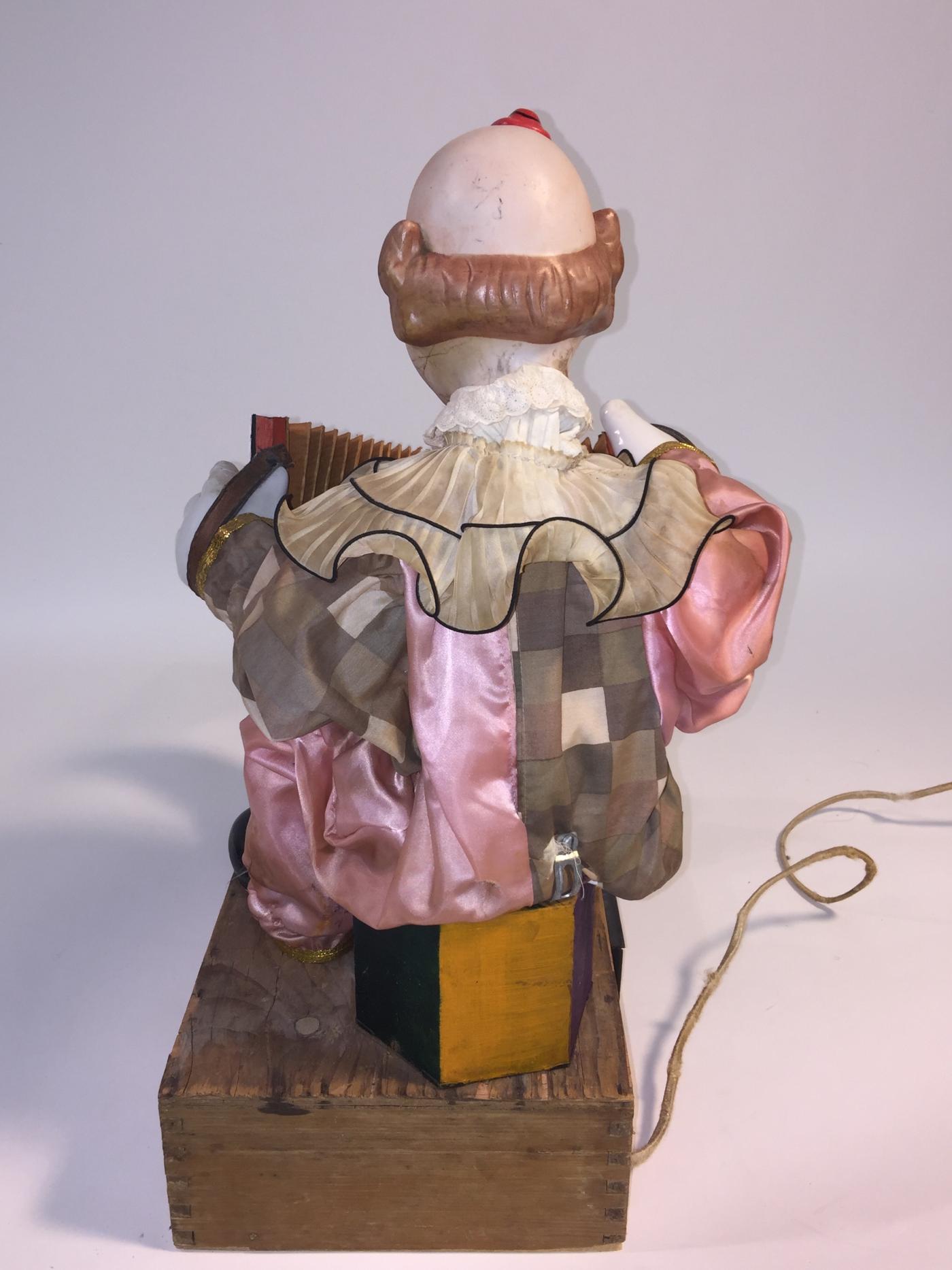 1940's HAND MADE CLOWN PLAYING ACCORDIAN AND MONKEY WITH FLAG AUTOMATON