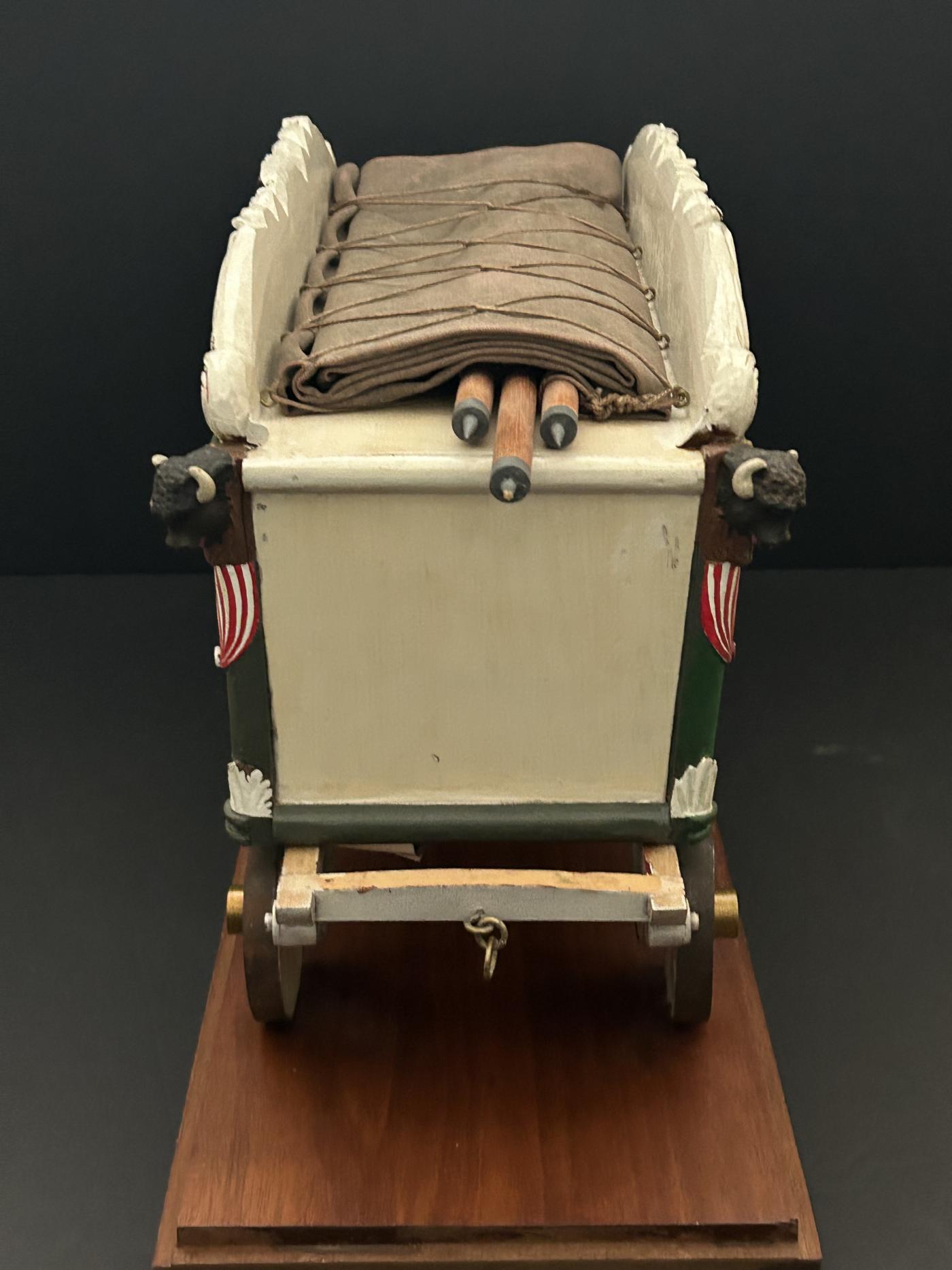 A Carved and Polychrome Paint-Decorated Model of a Circus Wagon.