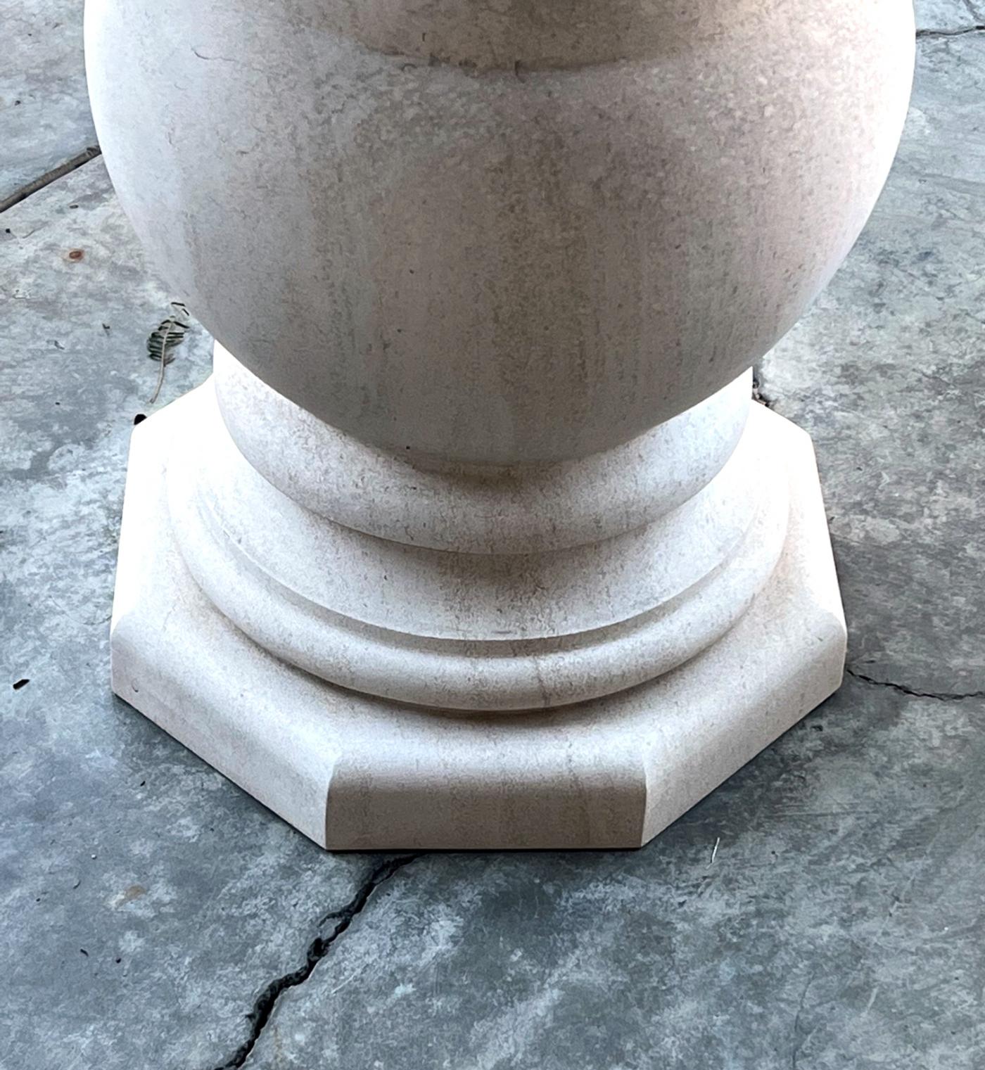 A French Carved Limestone Circular Table on a Baluster-form Base