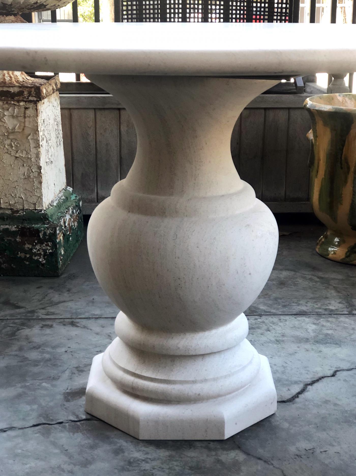 A French Carved Limestone Circular Table on a Baluster-form Base