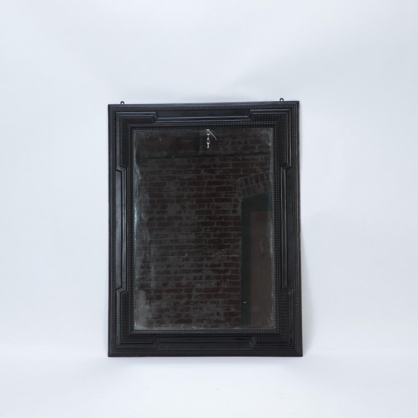 A Large Dutch style ebonIzed frame with ripple carving. Circa 1940.