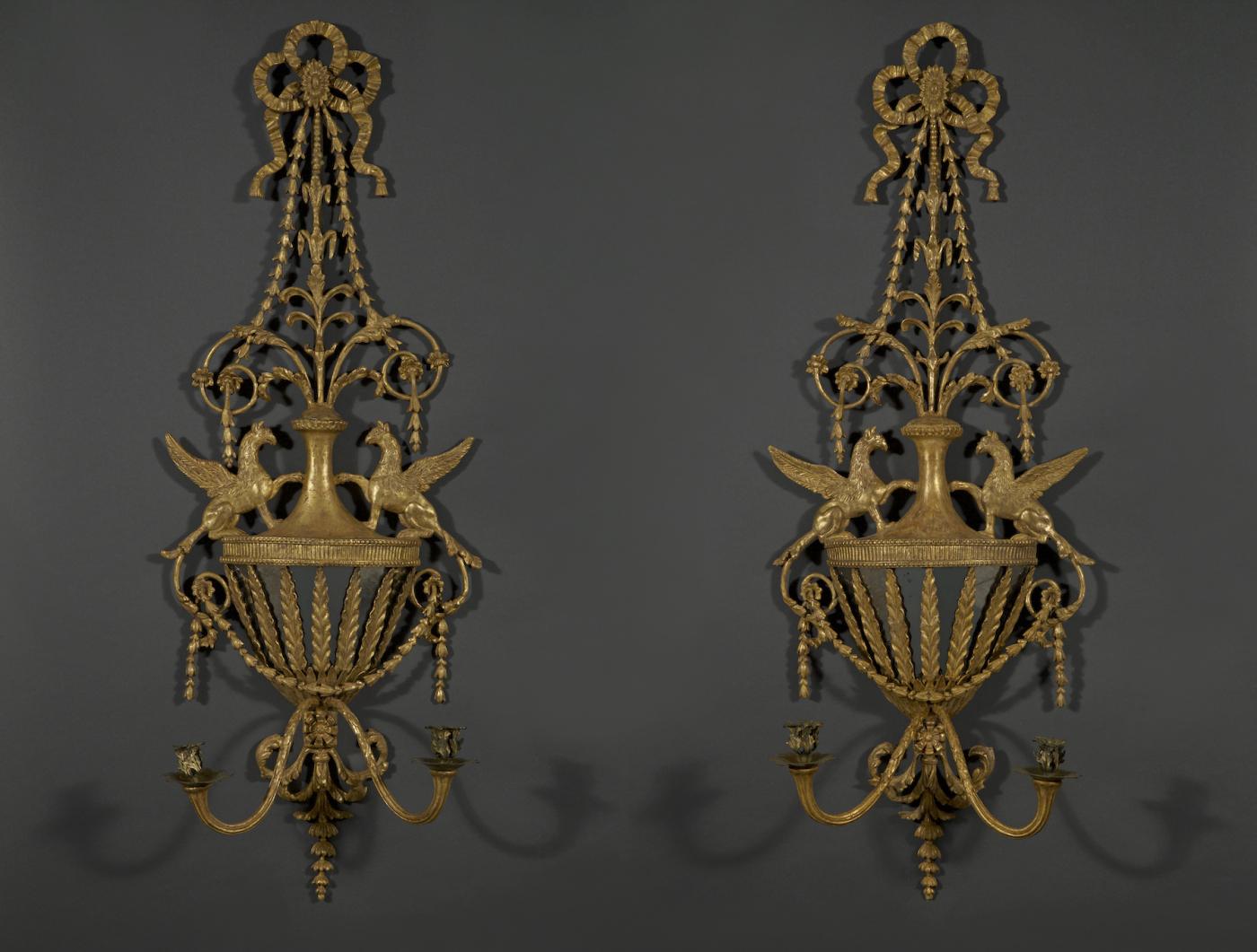 A PAIR OF 'CARTON-PIERRE' ADAM PERIOD WALL SCONCES SET WITH MIRROR GLASS
