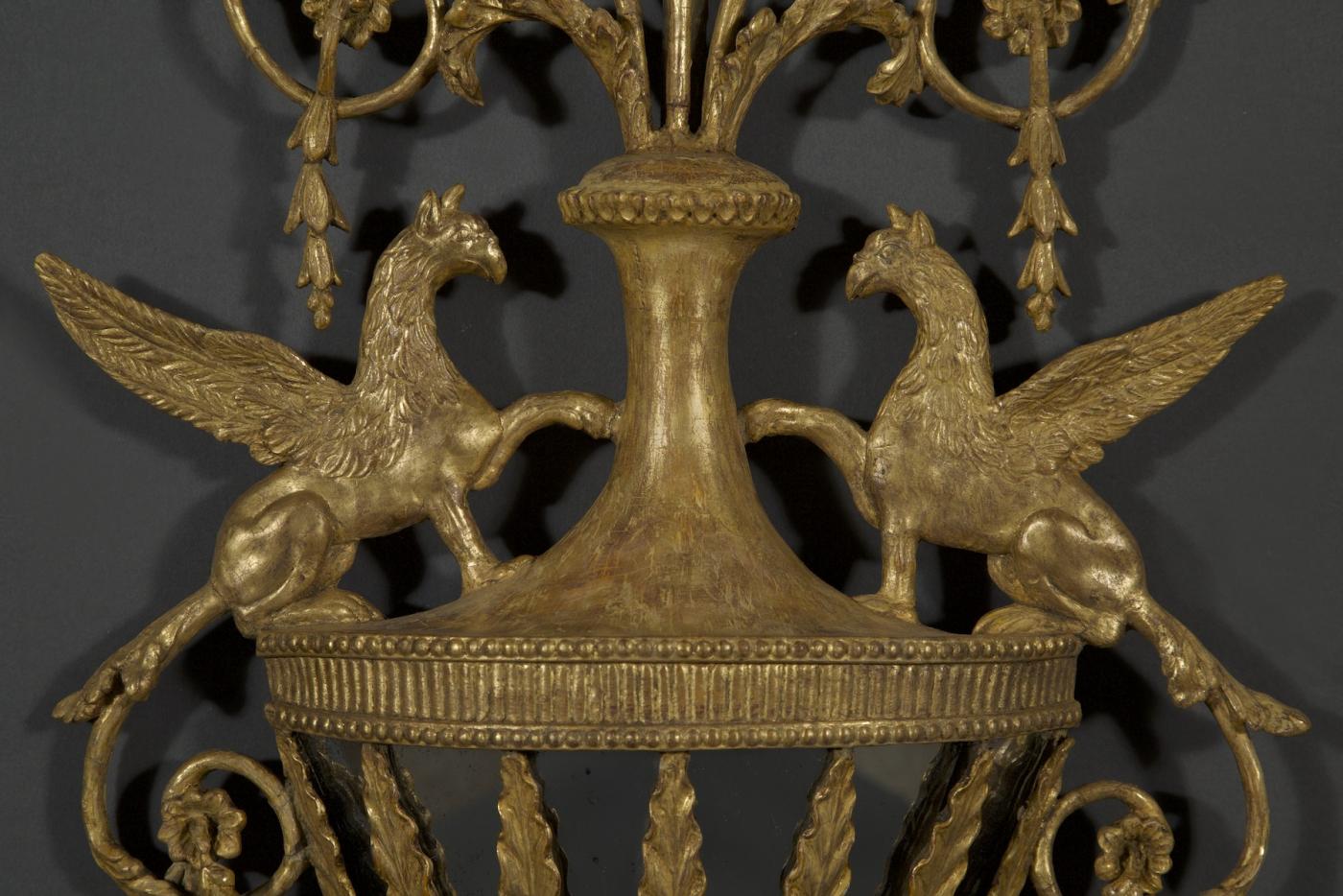 A PAIR OF 'CARTON-PIERRE' ADAM PERIOD WALL SCONCES SET WITH MIRROR GLASS