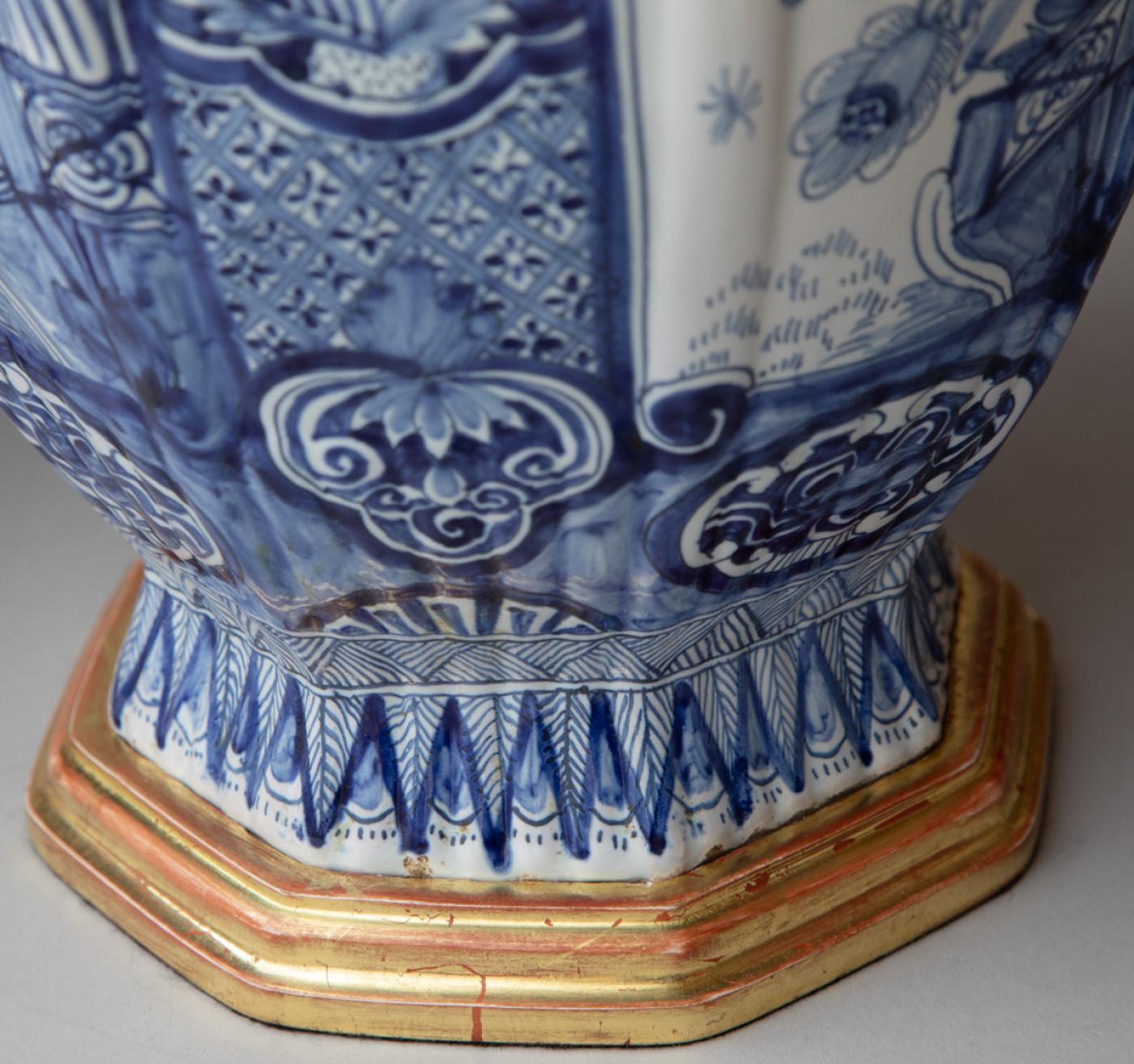 A PAIR OF EARLY 19TH CENTURY OCTAGONAL DUTCH DELFT GADROONED VASES