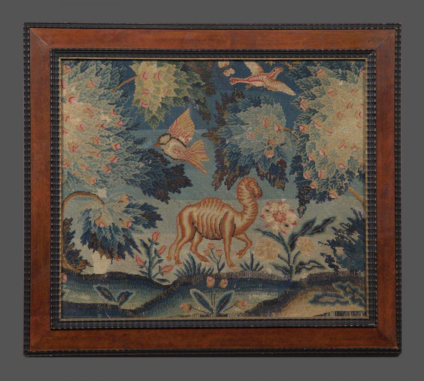A PAIR OF PETIT POINT NEEDLEWORK PICTURES DEPICTING AN ELEPHANT AND A CAMEL