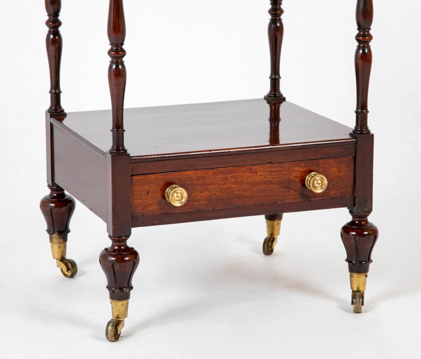 A Regency Four Tier Etagere with Rare Lotus Carved Legs