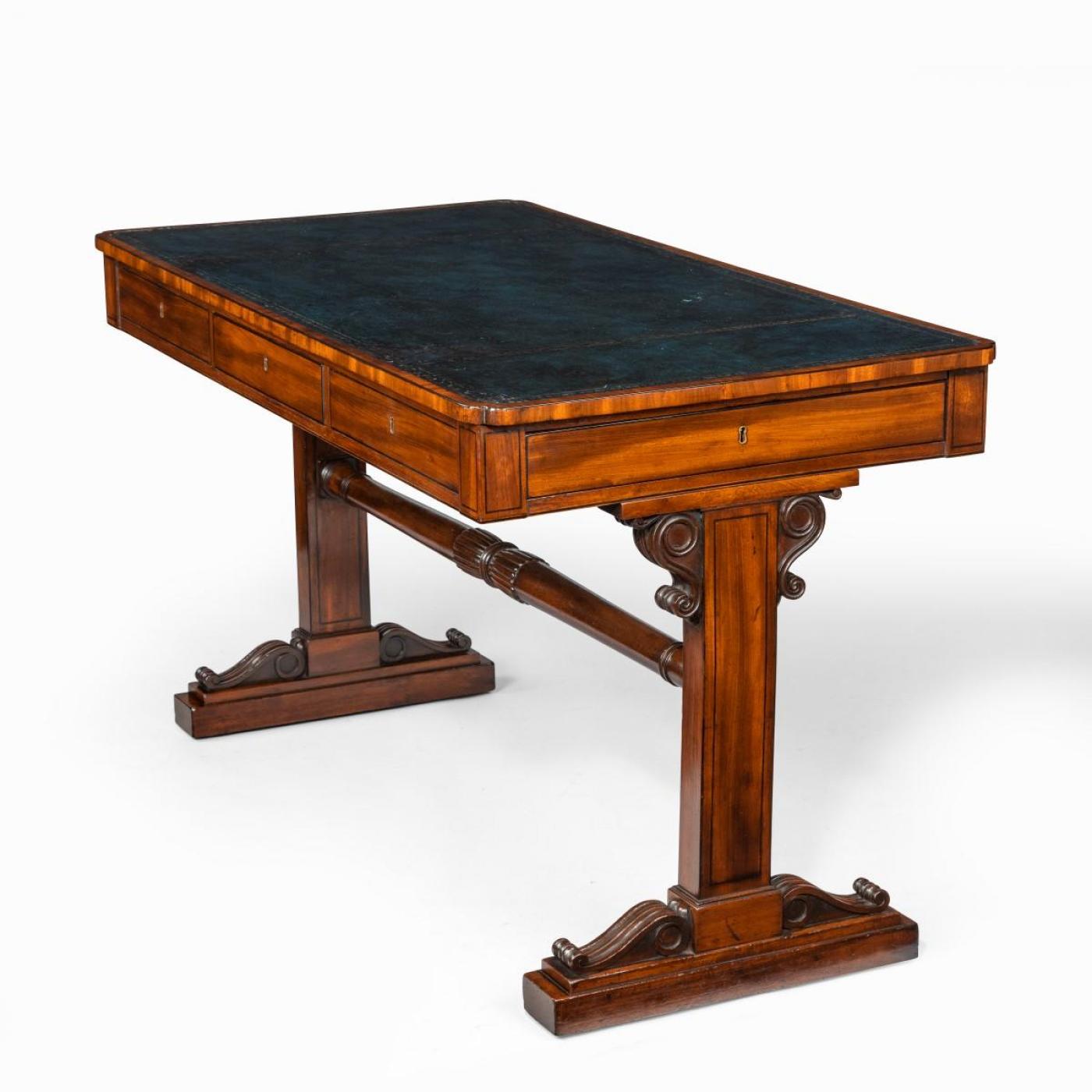 A Regency mahogany end support library table