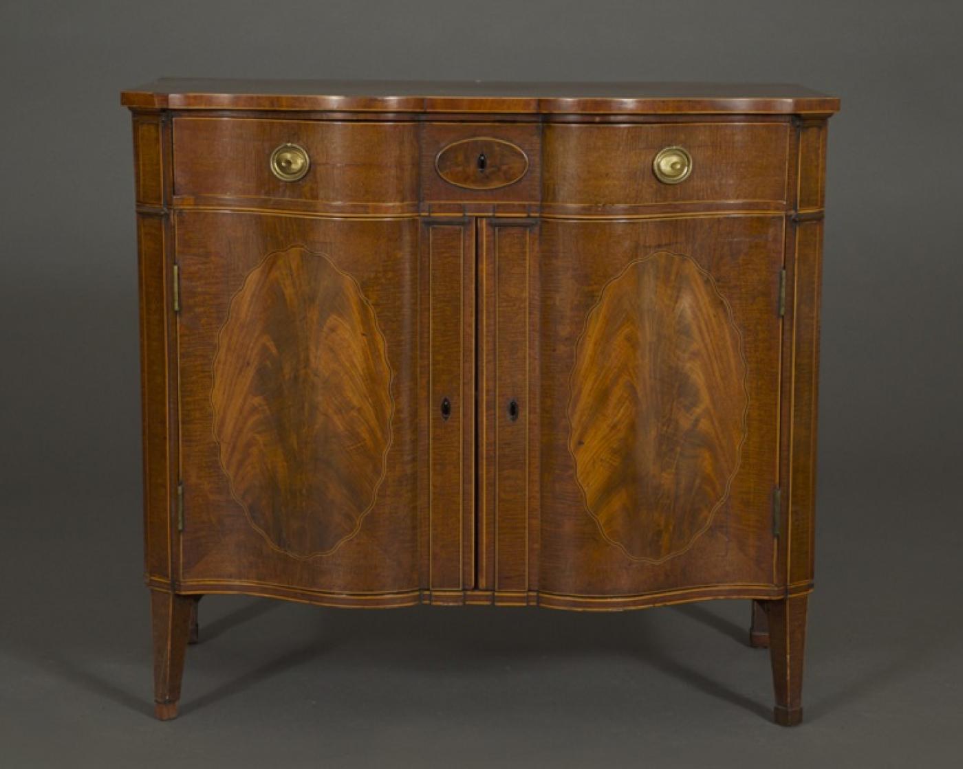 A SUPERB QUALITY FIDDLEBACK AND FLAME MAHOGANY TWO DOOR COMMODE