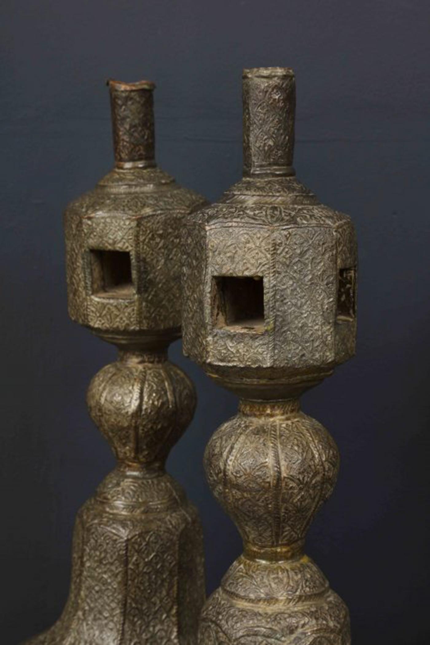 A Set of Four Large Copper Repousse Charpoy Legs