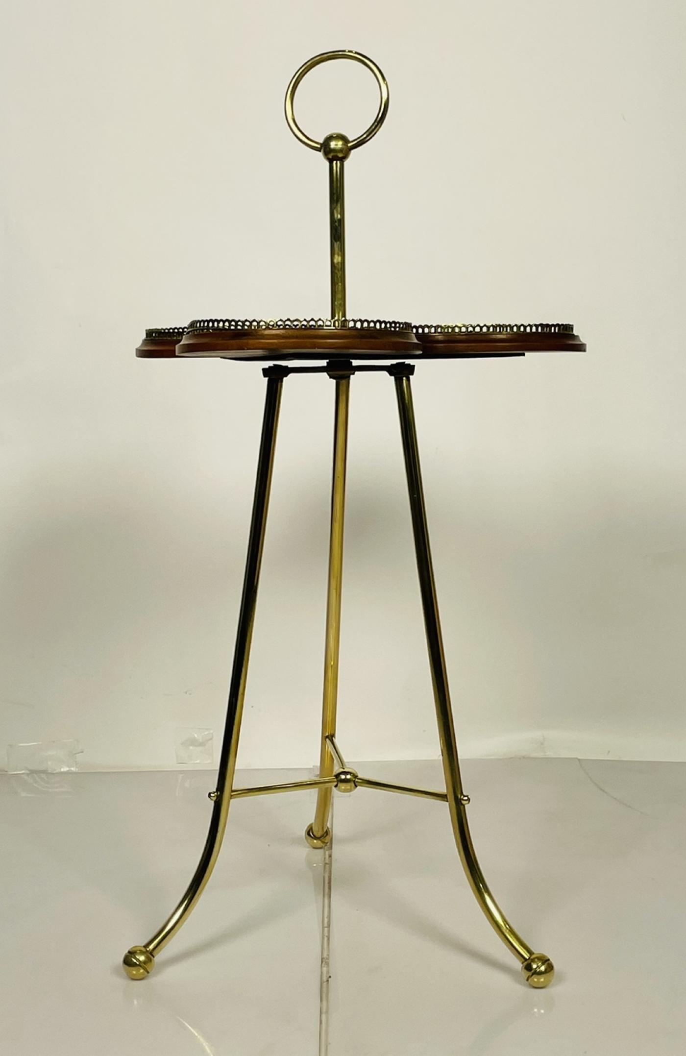 A Victorian Revolving Occasional Table in Brass & Mahogany.