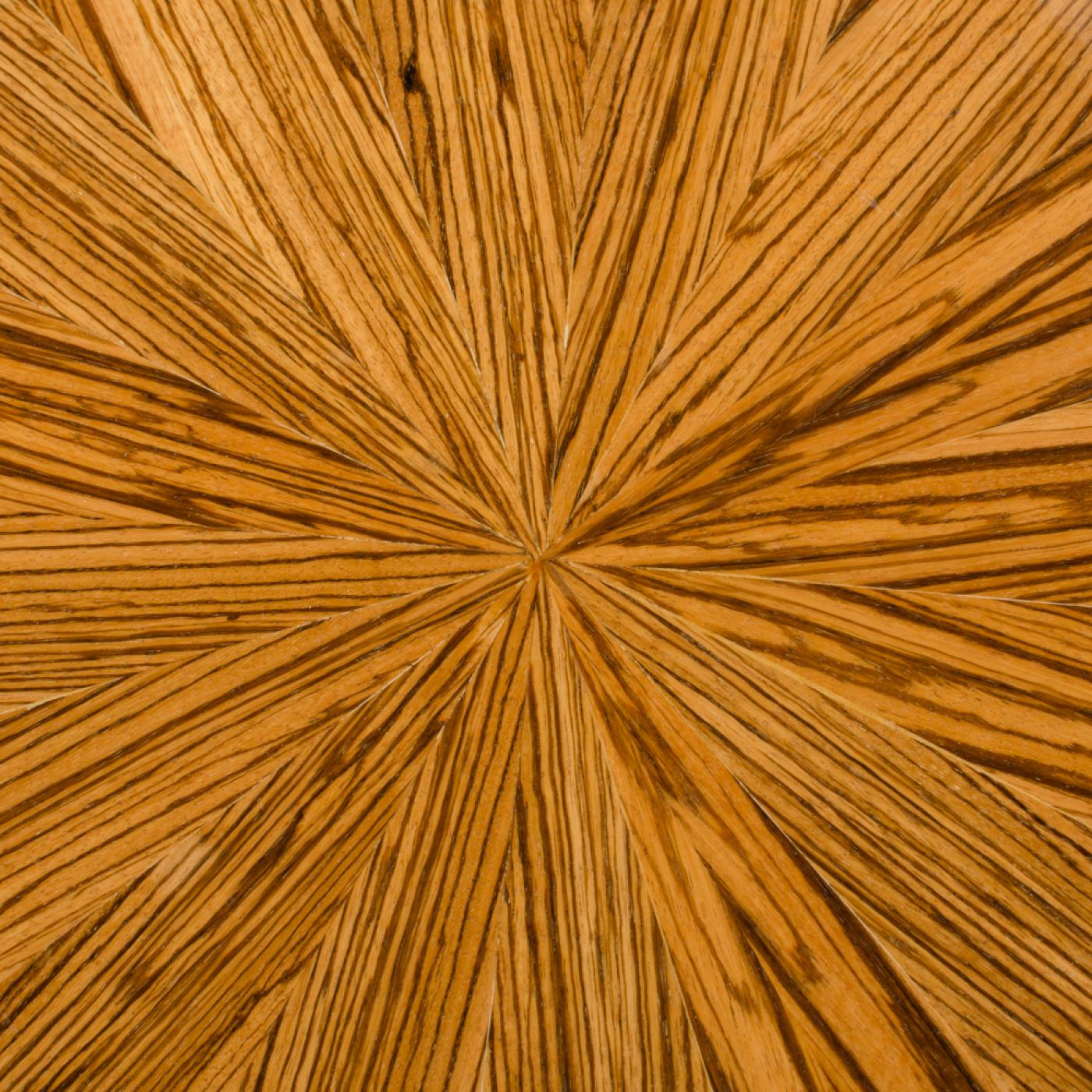 A contemporary round zebra wood table in the Art Deco style.
