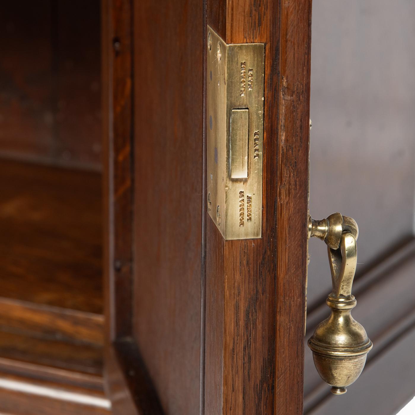 A late Victorian oak gun cabinet