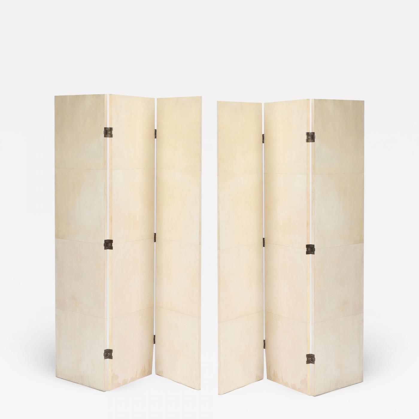 A pair of Contemporary parchment covered three panel folding screens.