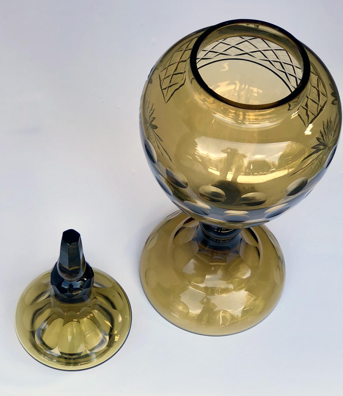 A striking and large Bohemian russet-colored glass covered urn