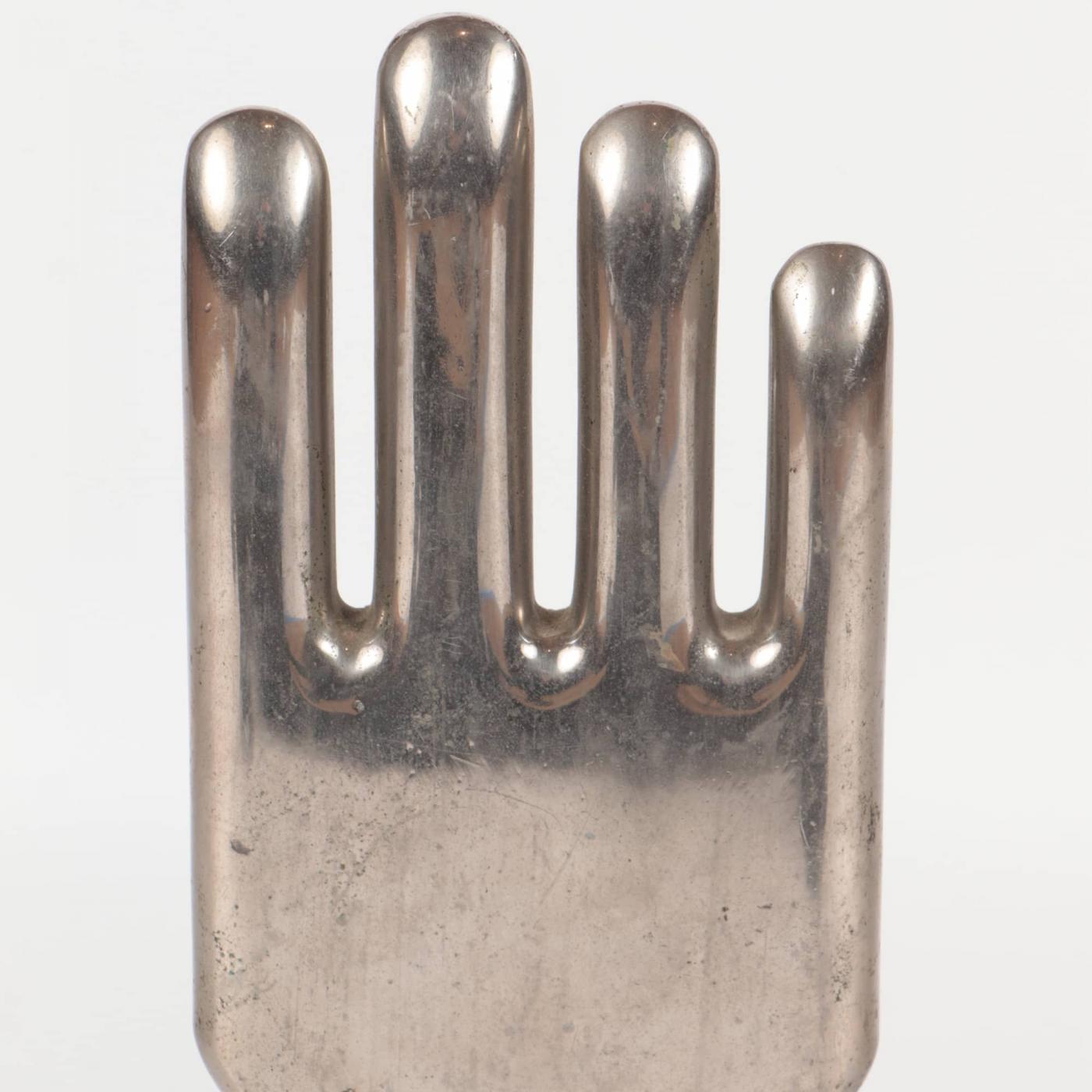 A vintage mid century modern chrome over nickel glove form mold circa 1970.