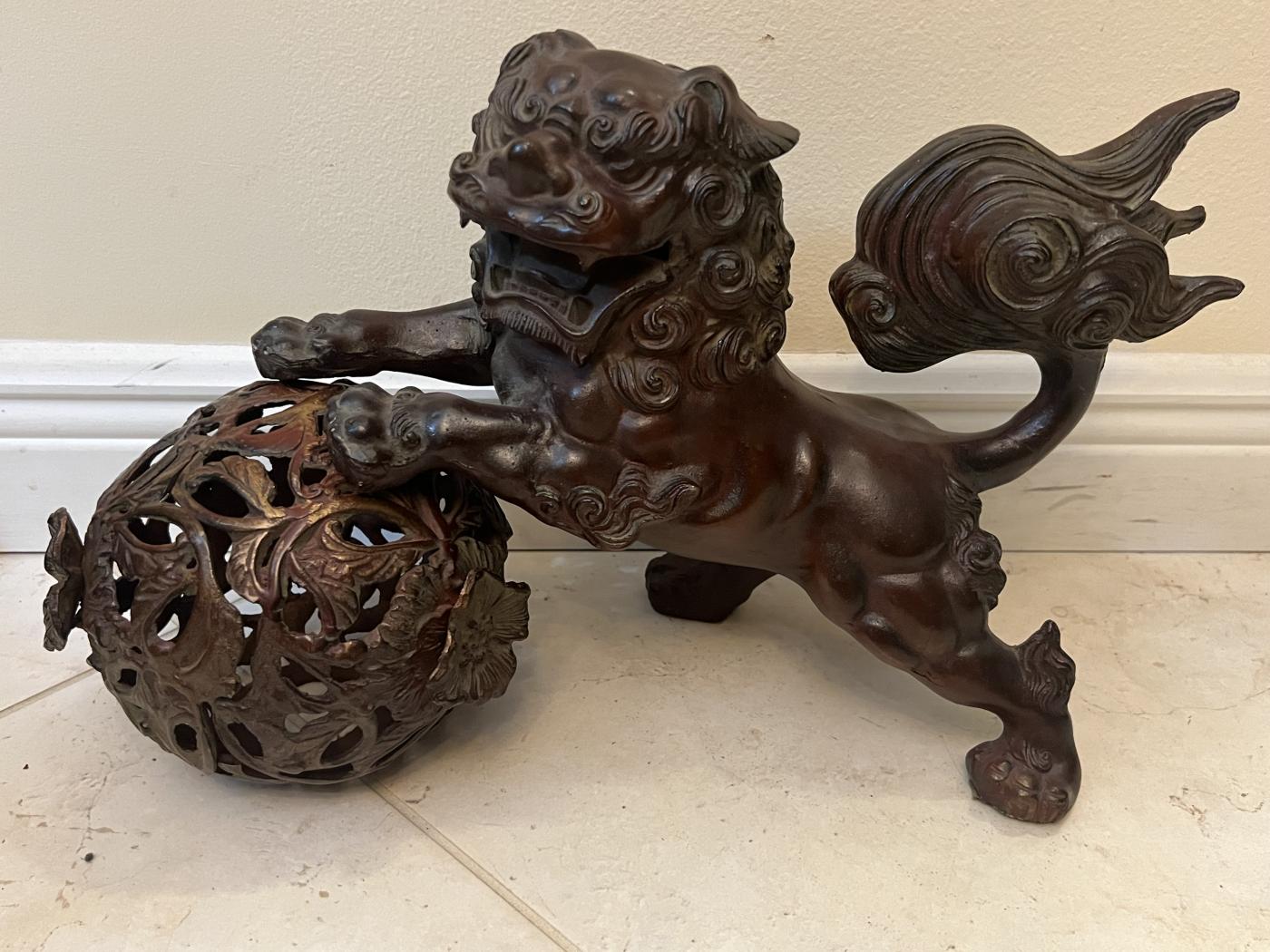 ANTIQUE PATINATED IRON FOO DOG WITH GILT BALL WITH FLOWERS SCULPTURE