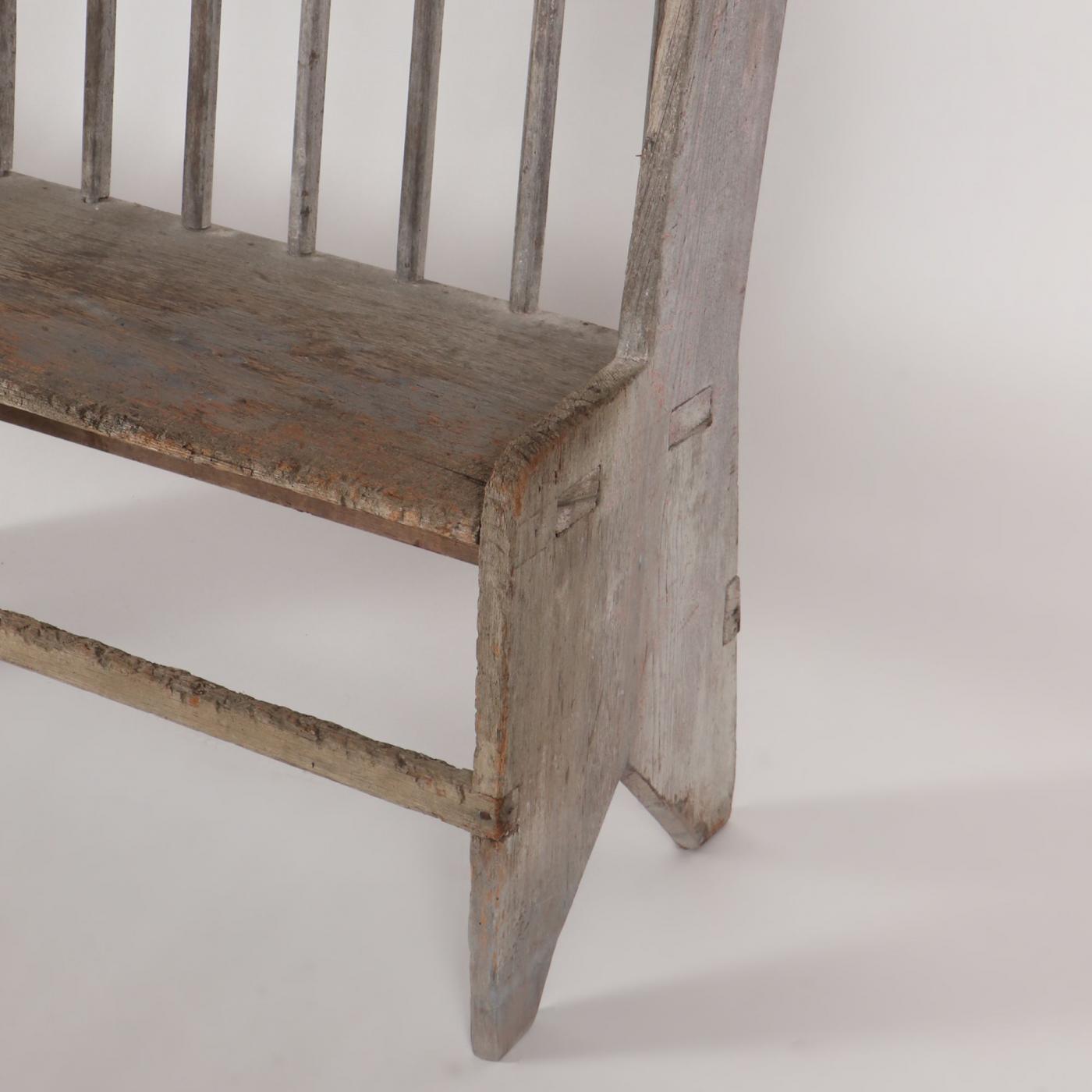 An antique wooden bench circa 1800.