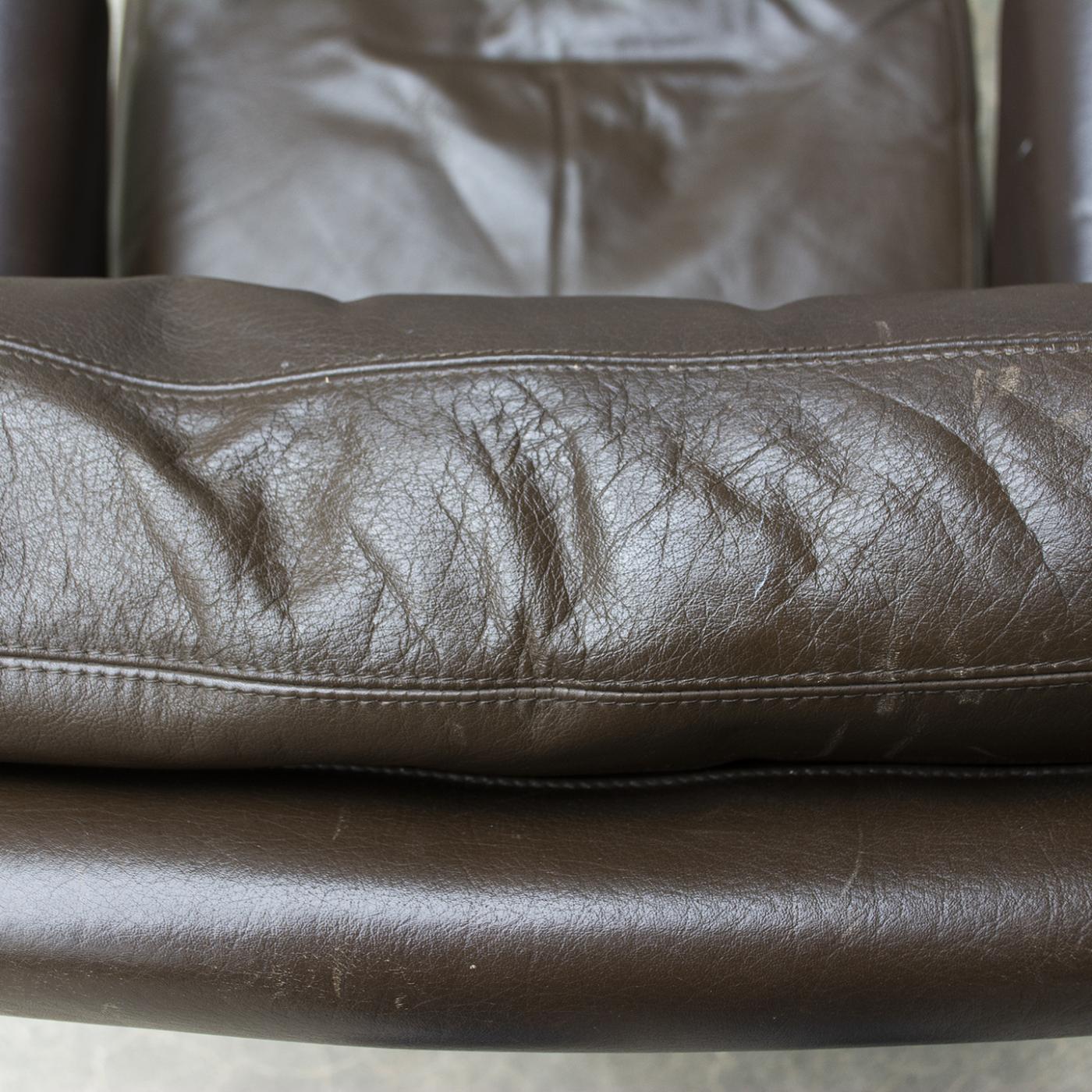 COR Swing Lounge Chair with Matching Ottoman in Leather and Steel Frame