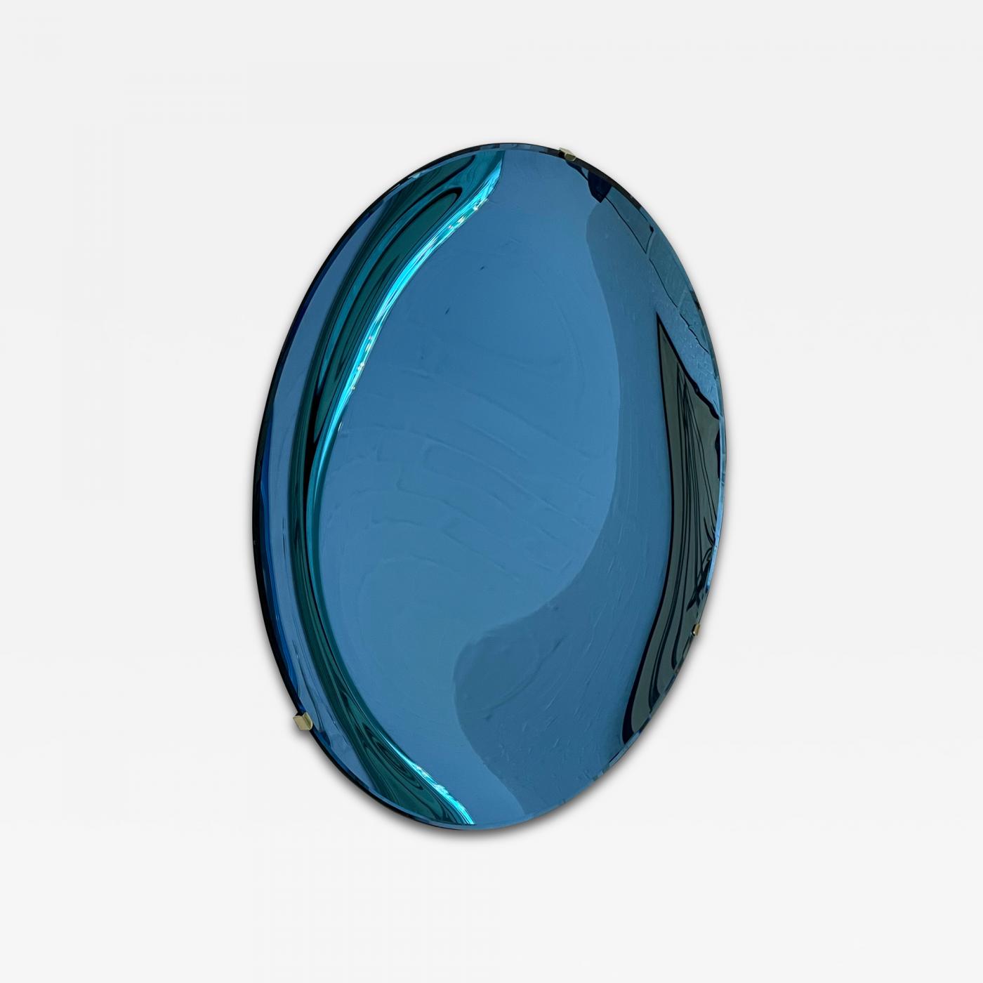 Circular concave blue mirrored wall piece