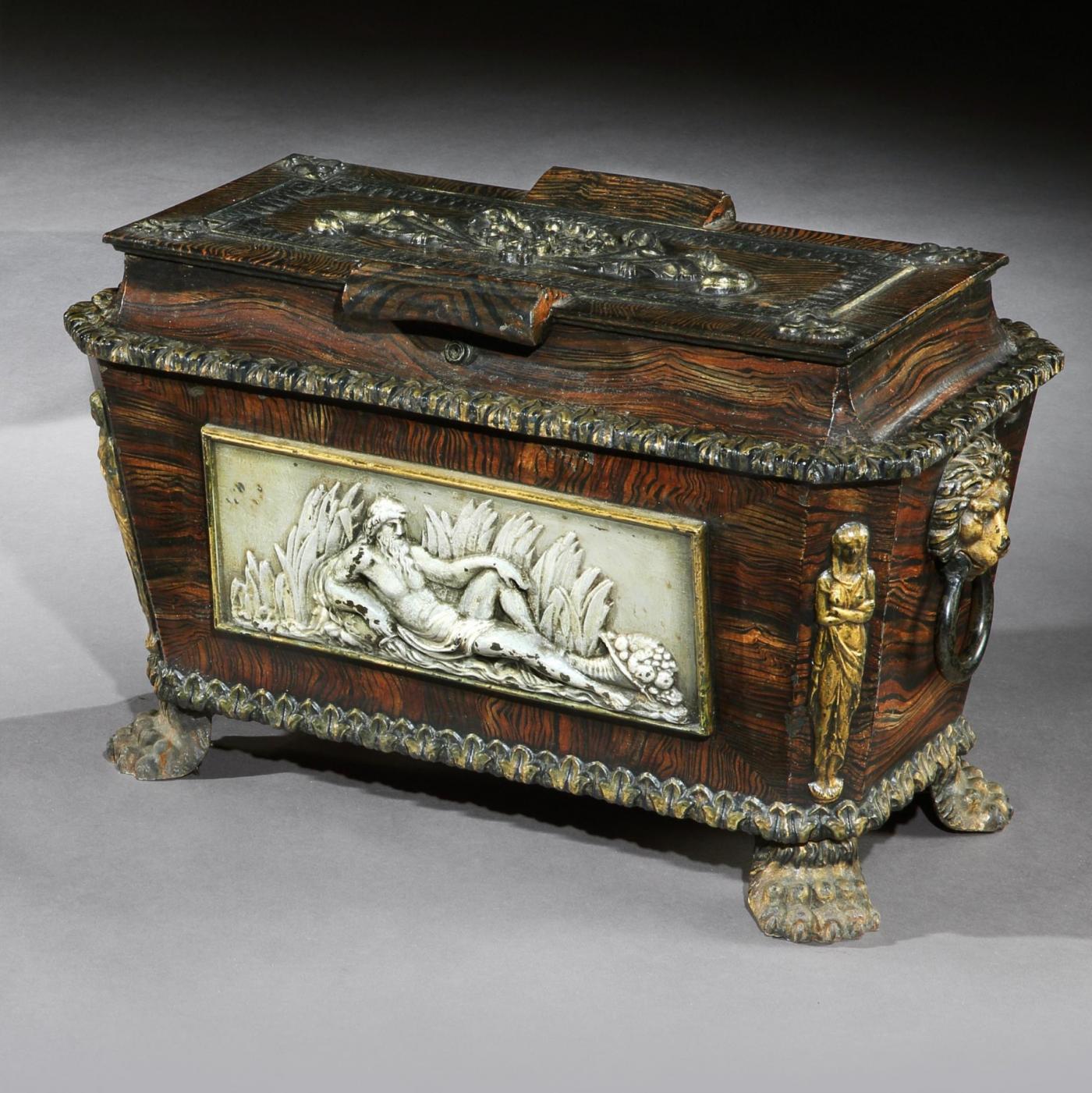EXTREMELY RARE PAIR OF REGENCY CAST-IRON SARCOPHAGUS SHAPED STRONG BOXES