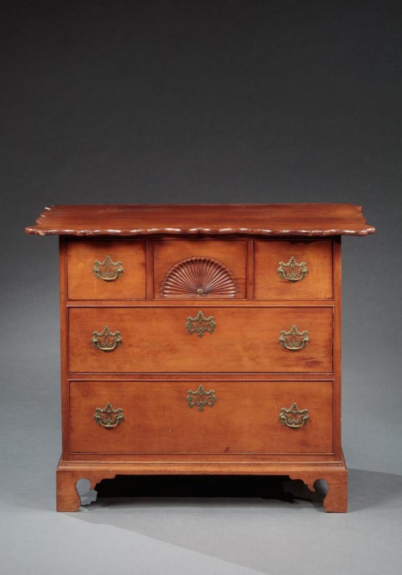 FAN CARVED CHEST OF DRAWERS WITH A SCALLOPED TOP