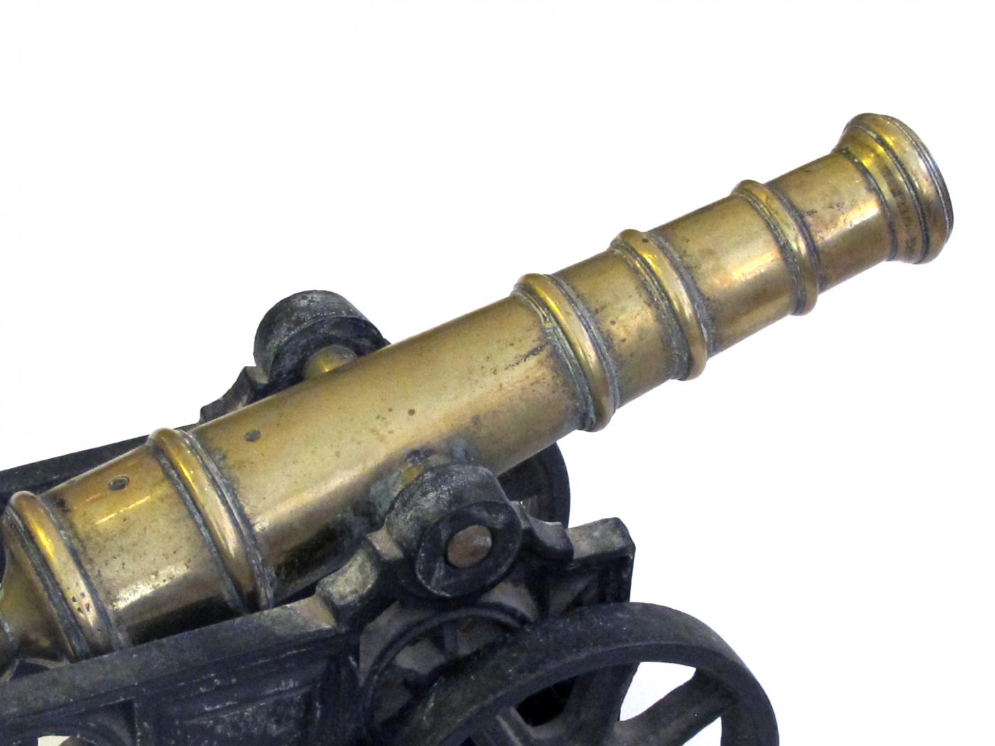 Finely rendered English Victorian brass ornamental cannon on cast iron ...