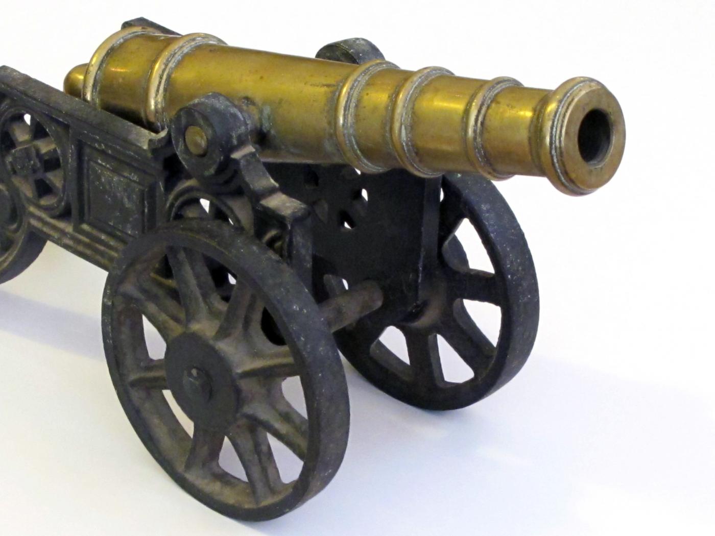 Finely rendered English Victorian brass ornamental cannon on cast iron ...