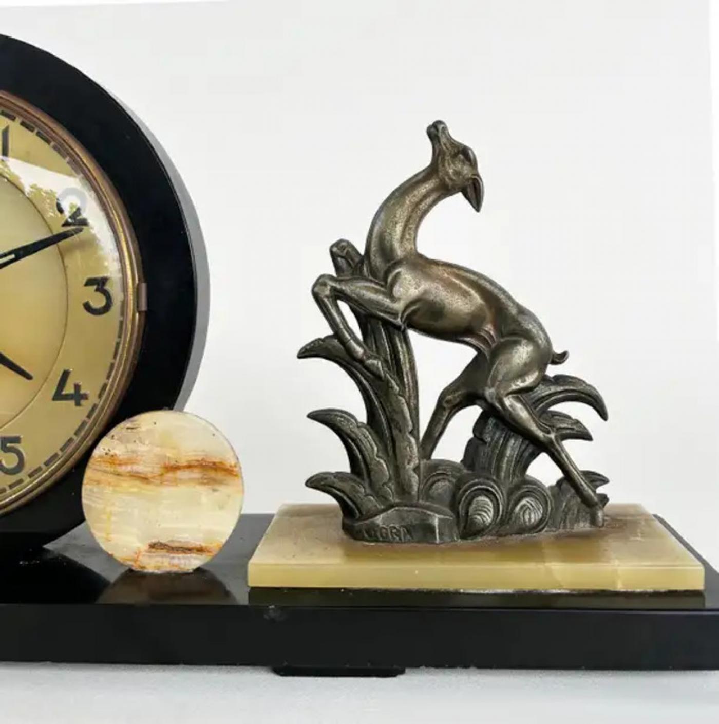 French Art Deco Marble Onyx Mantel Clock with Gazelles Signed Ucra 1930s