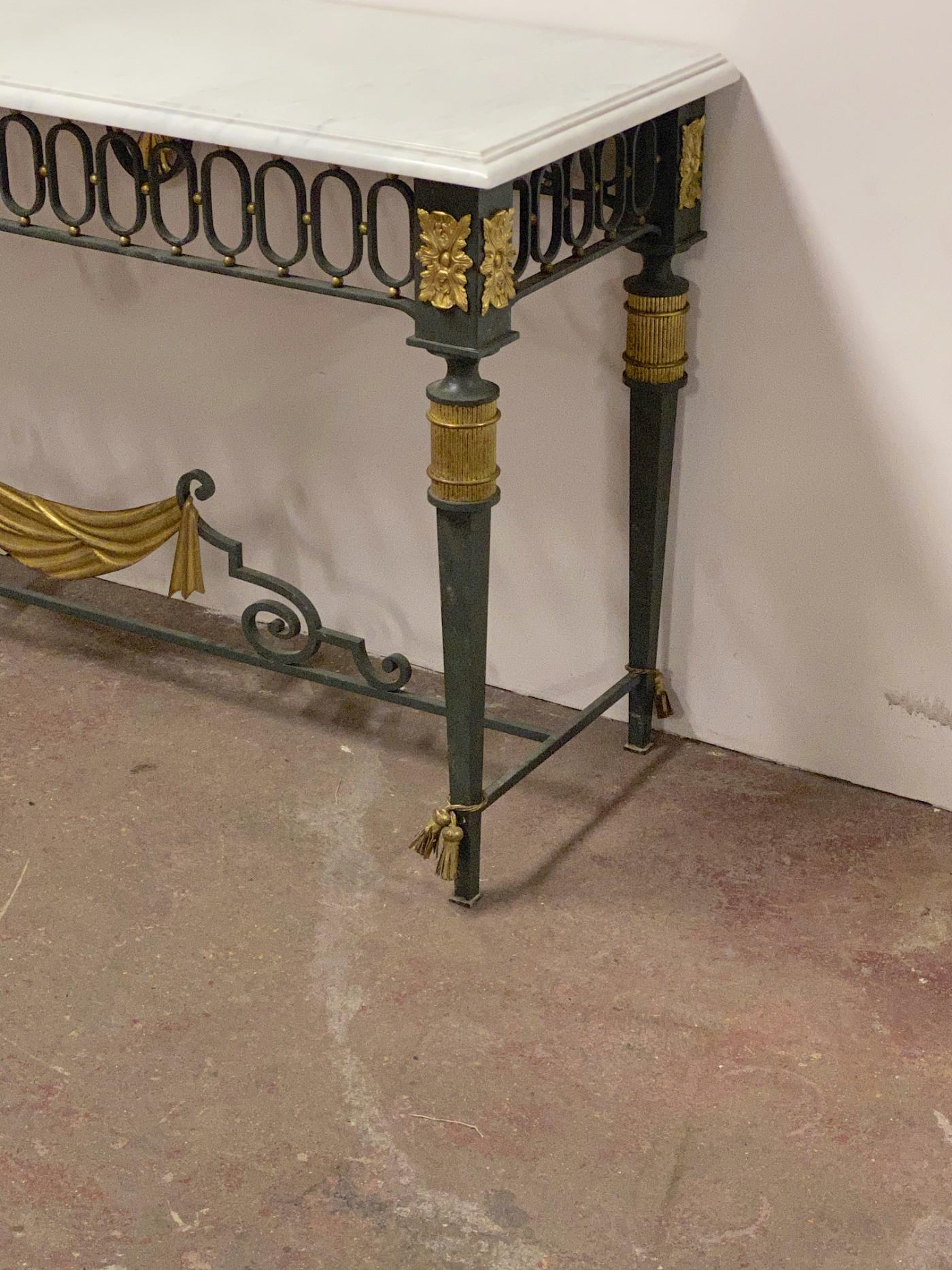French Neo classical gold leaf metal patinated console with a marble top