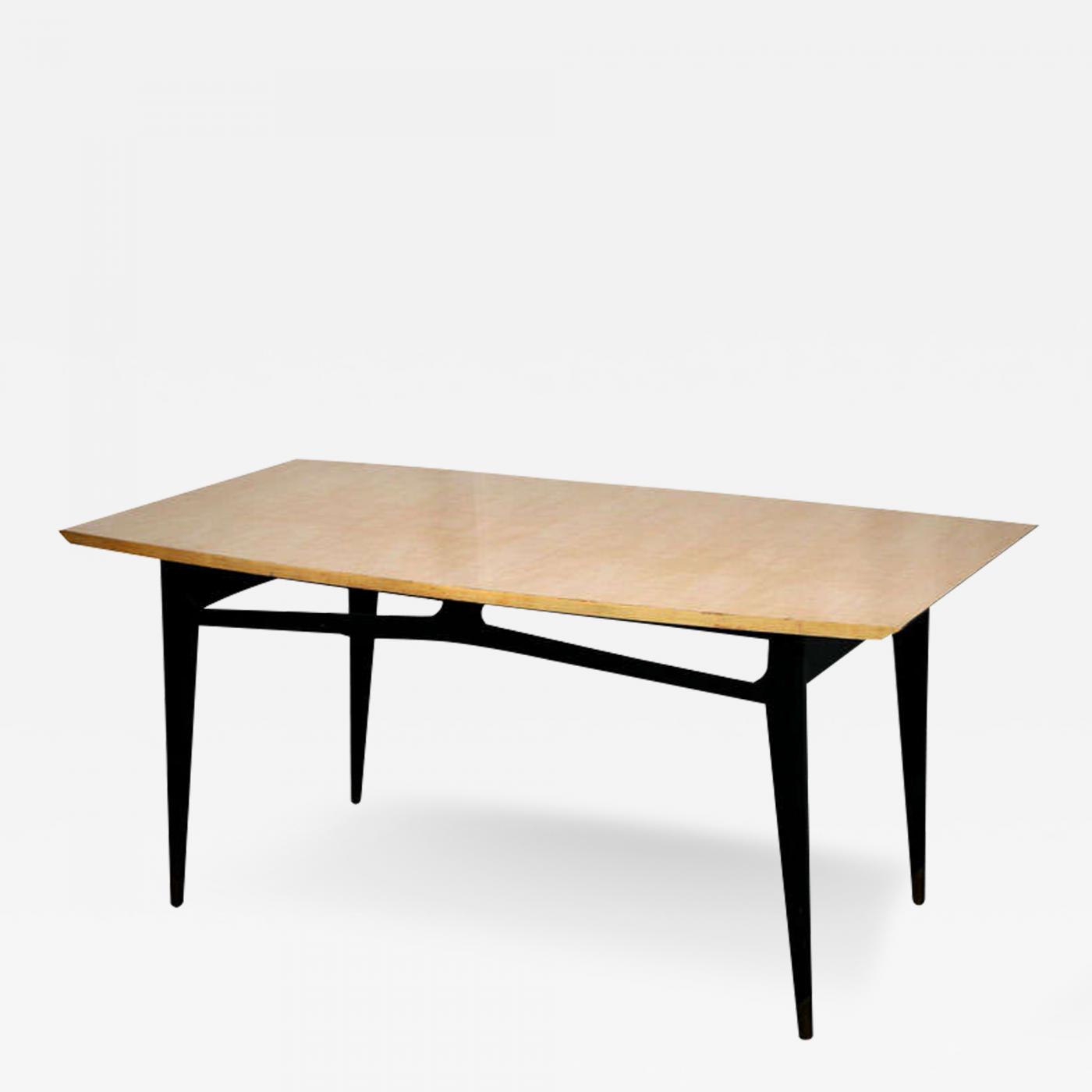 Laminated beech top and black lacquered wood base with brass-tipped legs.