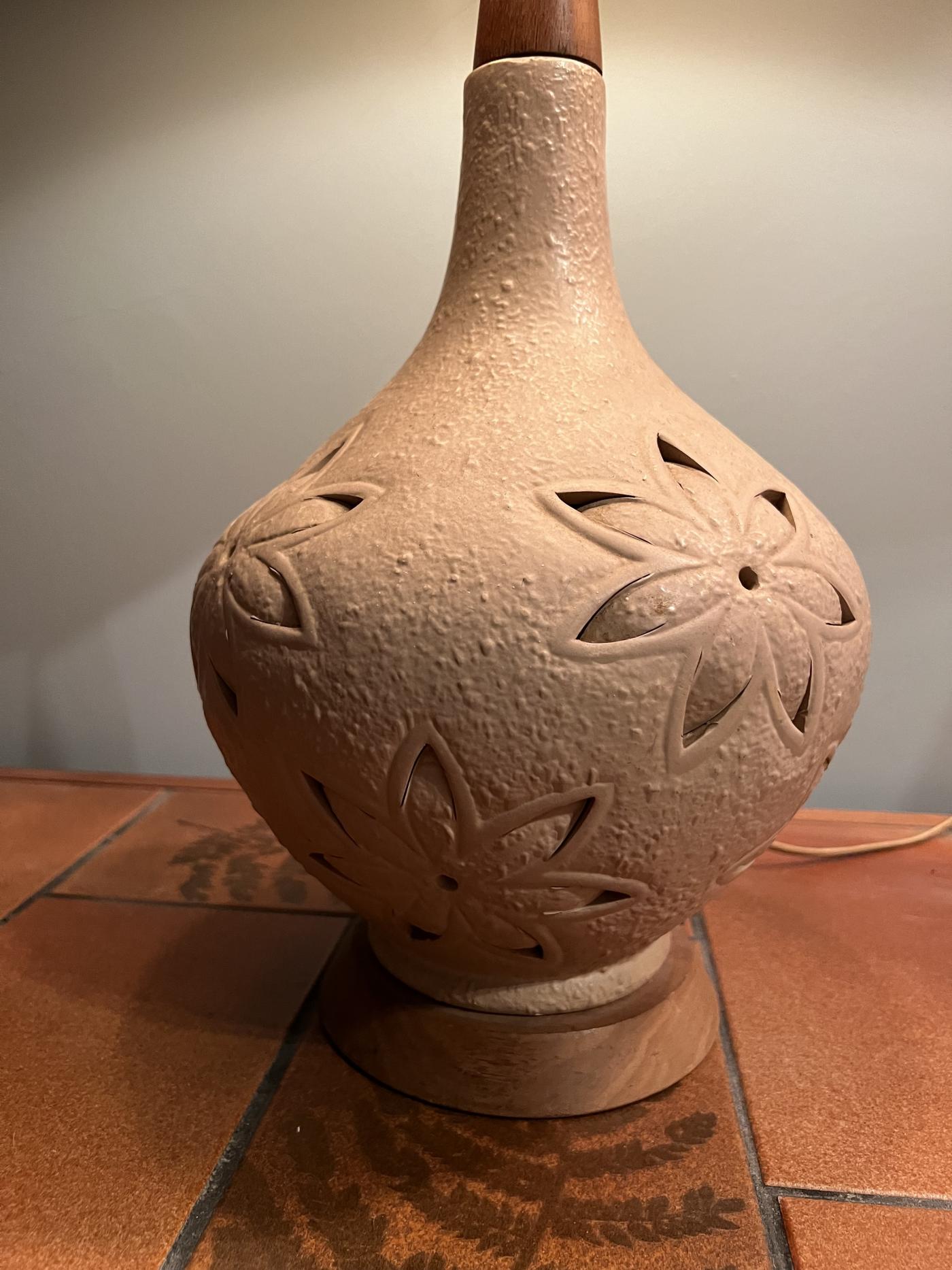 MID CENTURY FLOWER INCISED CERAMIC AND WOOD LAMPS WITH INTERNAL LIGHT