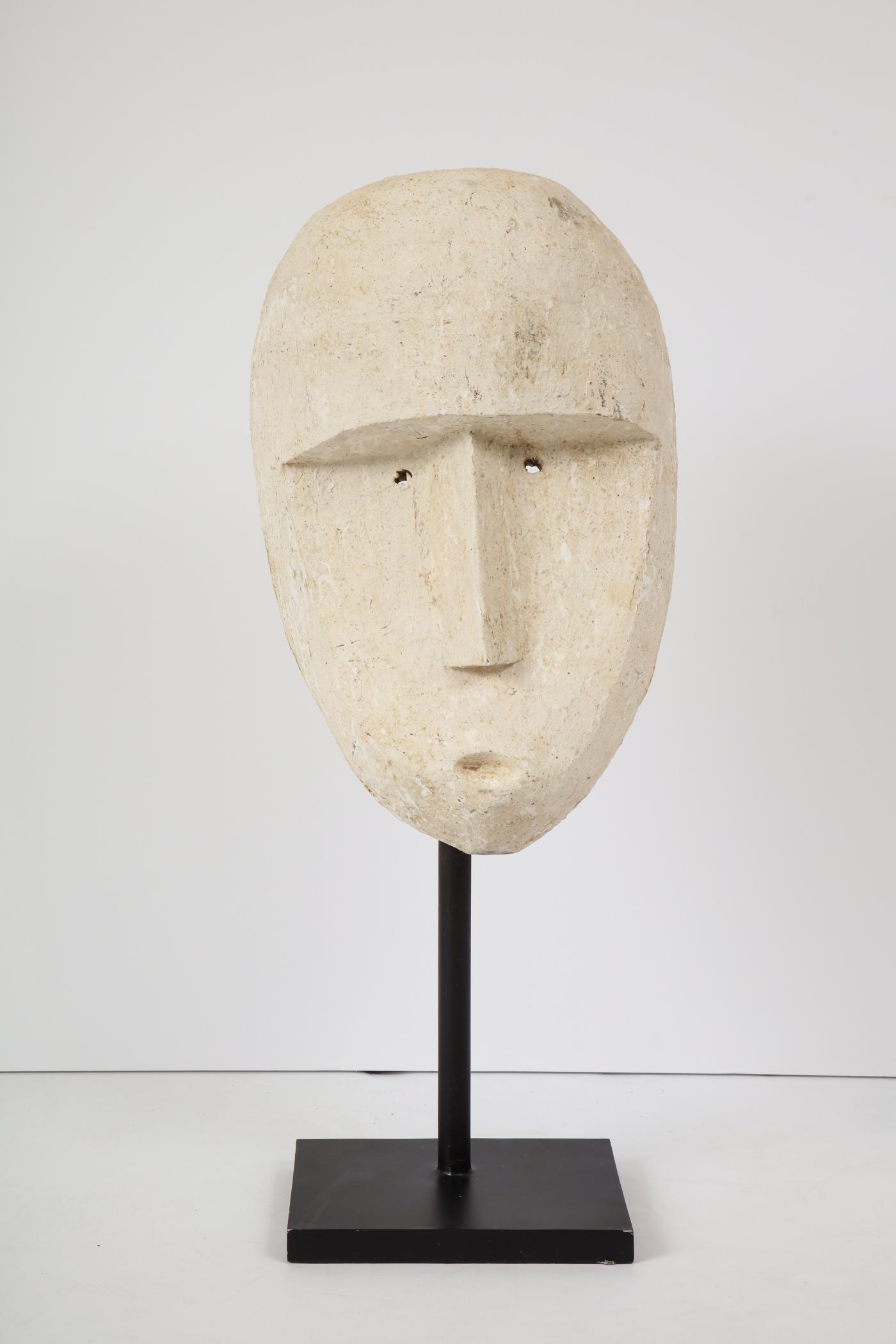 Pair of Balinese carved modernist plaster mask sculptures