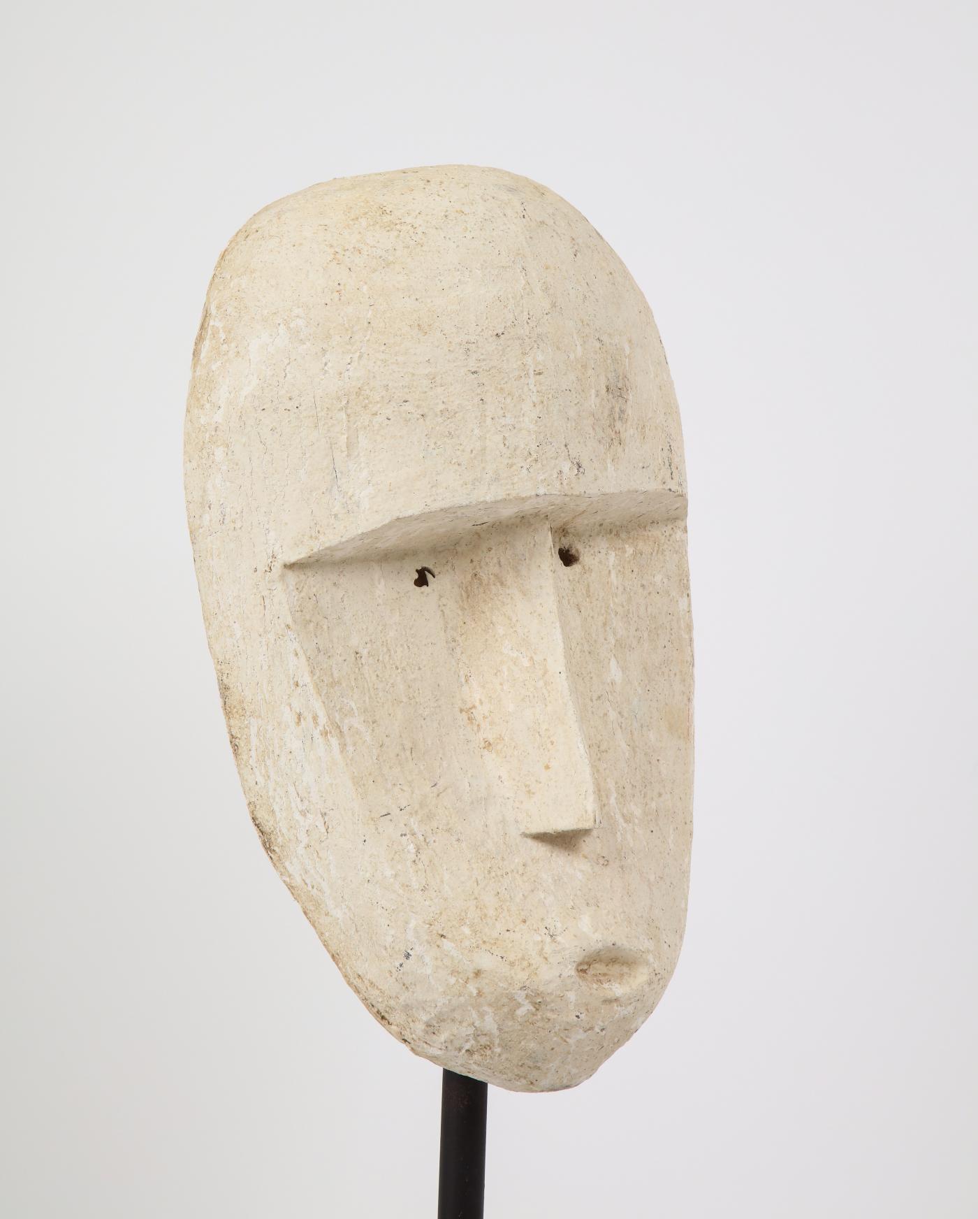 Pair of Balinese carved modernist plaster mask sculptures