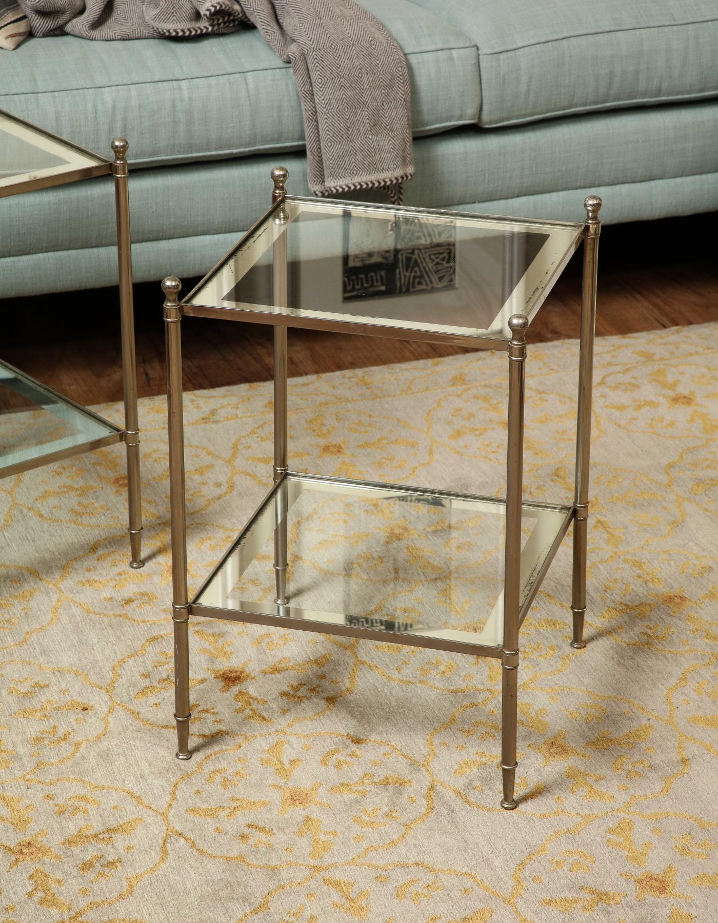Pair of two-tiered silver gilt side tables