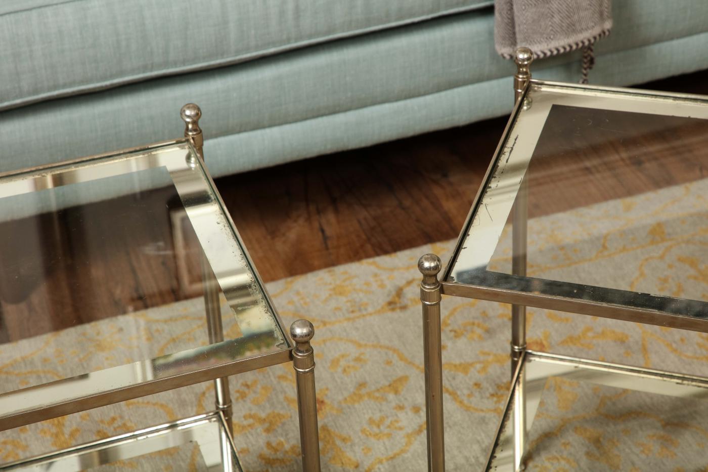 Pair of two-tiered silver gilt side tables