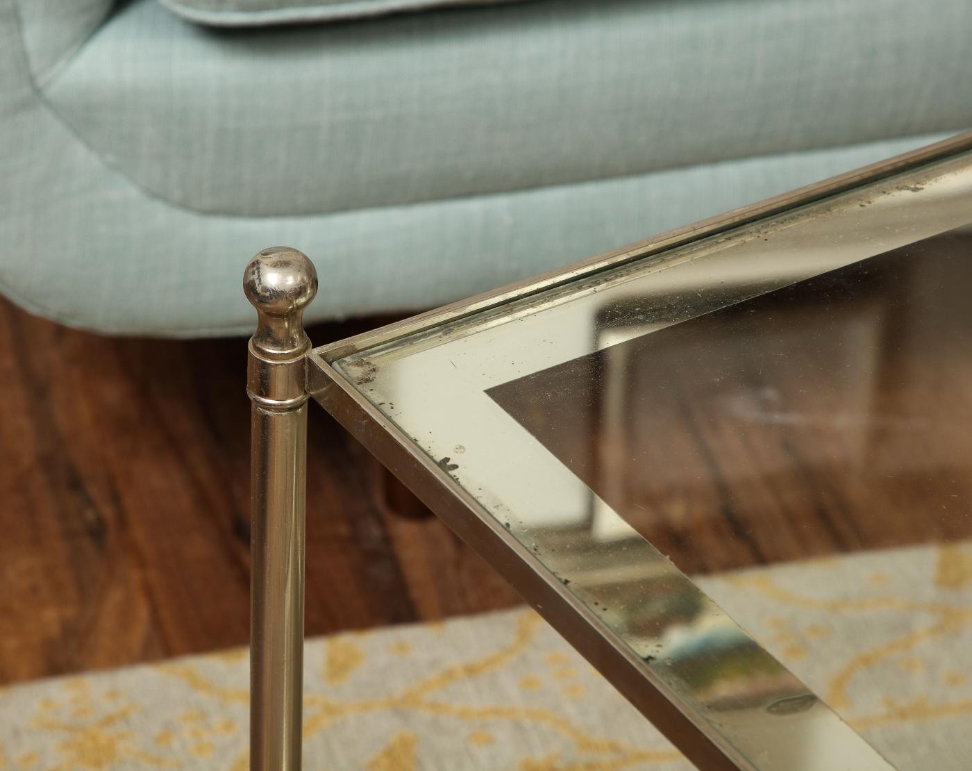 Pair of two-tiered silver gilt side tables