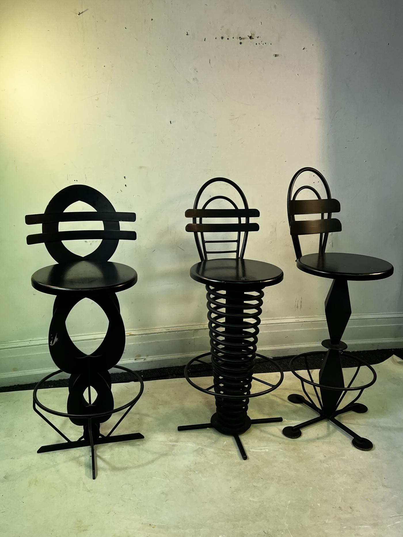 TRIO OF SCULPTURAL BLACK METAL AND WOOD POST MODERN BAR STOOLS