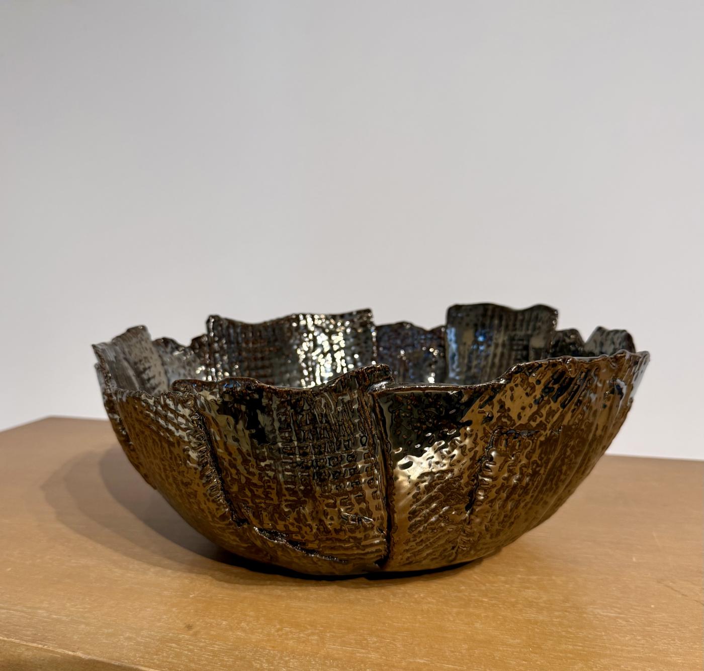 Waffle textured bowl in a black-chrome metallic glaze. Made By Aram C.